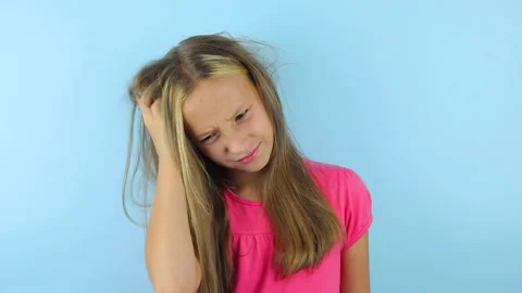 Girl Scratches Head Stock Footage ~ Royalty Free Stock Videos | Pond5