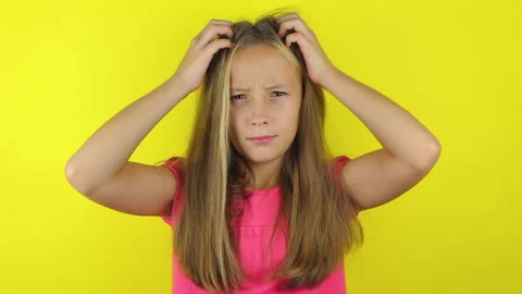 Girl Scratches Head Stock Footage ~ Royalty Free Stock Videos | Pond5