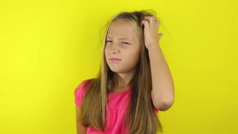 Girl Scratches Head Stock Footage ~ Royalty Free Stock Videos | Pond5
