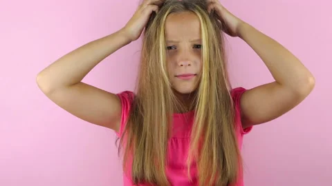 Girl Scratches Head Stock Footage ~ Royalty Free Stock Videos | Pond5