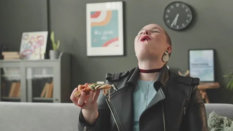 Girl with Shaved Head Eating Pizza at Ca... | Stock Video | Pond5