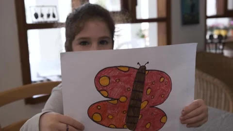 Girl showing her drawing to the camera. ... | Stock Video | Pond5