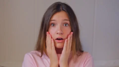 Girl showing surprise reaction while res... | Stock Video | Pond5