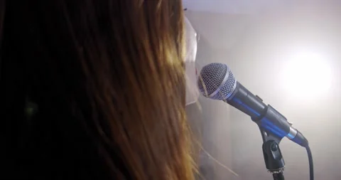 The girl singer stands back to the camer... | Stock Video | Pond5