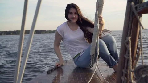 girl sitting on the stern of the yacht. ... | Stock Video | Pond5