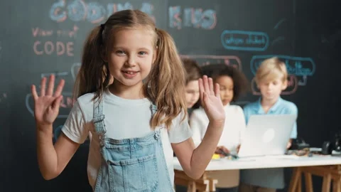Girl smiling and waving to camera while ... | Stock Video | Pond5