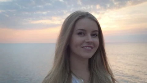 Girl smiling at sunset | Stock Video | Pond5