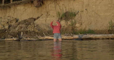 Girl Stands Knee-deep in Sea Water. Pull... | Stock Video | Pond5
