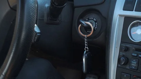 girl start engine of a car | Stock Video | Pond5