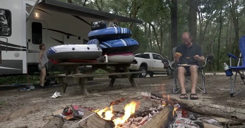 Girl Steps out of 5th Wheel to Sit Aroun... | Stock Video | Pond5