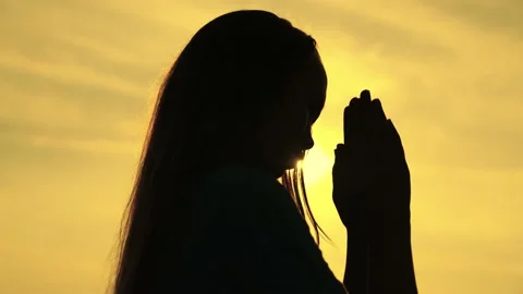 girl sunset clasping her hands palms tog... | Stock Video | Pond5