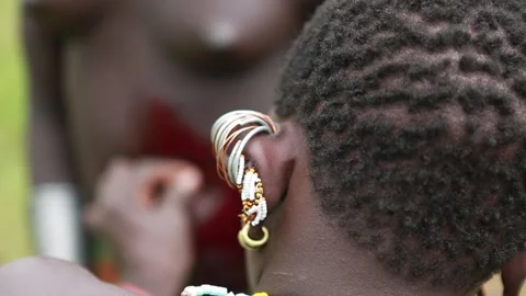 Girl from Suri tribe during a scarifica... | Stock Video | Pond5