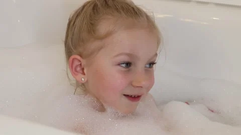 Girl taking a bubble bath. | Stock Video | Pond5
