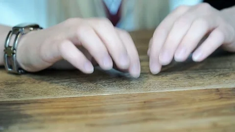 Girl tapping with her fingernails on woo... | Stock Video | Pond5