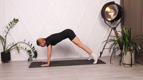 Girl training. Plank on equal hands with... | Stock Video | Pond5