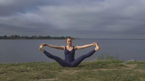 girl trains stretching, yoga practice | Stock Video | Pond5