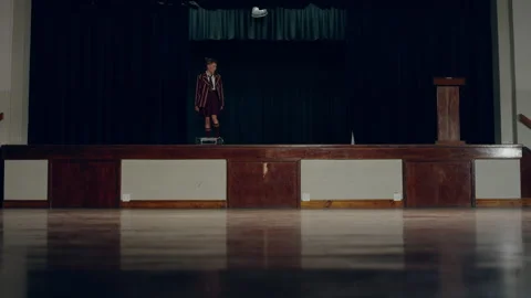 Girl in a uniform getting on a stage wit... | Stock Video | Pond5