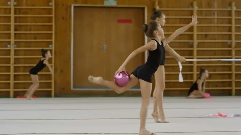 Girl Using Ball for Gymnastics Class | Stock Video | Pond5