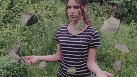 Girl using telekinesis, brain force or m... | Stock Video | Pond5