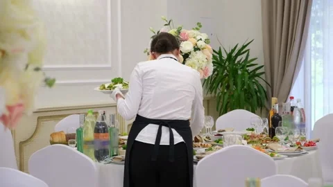 Girl waiter sets the table. | Stock Video | Pond5