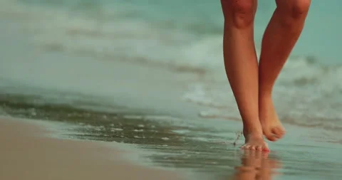 The girl is walking on a sand beach in P... | Stock Video | Pond5