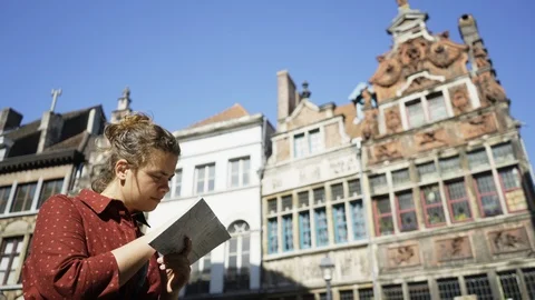 Girl watching map on street | Stock Video | Pond5
