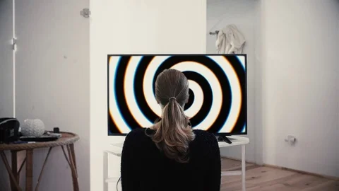 Girl Watching TV Gets Hypnotized With Im... | Stock Video | Pond5