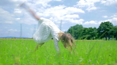 Girl in White Doing Jumpy-jumpy and Whee... | Stock Video | Pond5