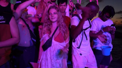 Girls and boys dance on the sandy beach ... | Stock Video | Pond5