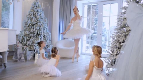 The girls are wearing white tutus and ap... | Stock Video | Pond5