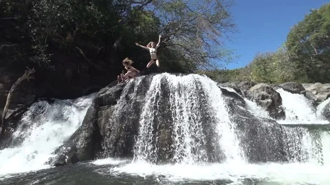 Girls Cliff Jumping Stock Footage ~ Royalty Free Stock Videos | Pond5