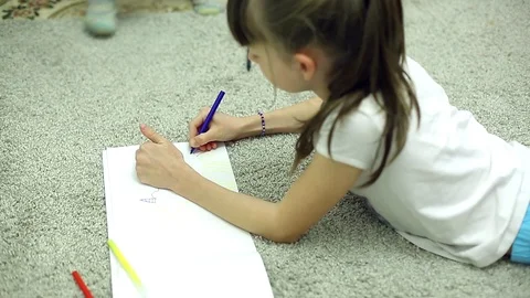 girls draw markers in the album lying on... | Stock Video | Pond5