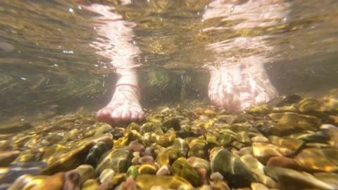 Girls feet and toes underwater on edge o... | Stock Video | Pond5