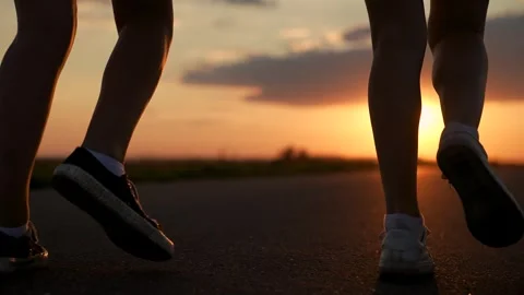 Girls feet run along road training, , te... | Stock Video | Pond5