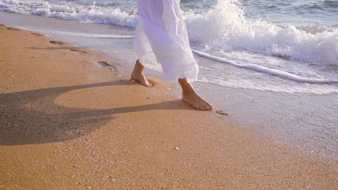 girls feet walking on the surf, slow mot... | Stock Video | Pond5