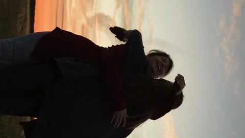 Girls friends hugging at sunset in park,... | Stock Video | Pond5