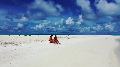 Girls Tanning on a Private Beach on Thei... | Stock Video | Pond5