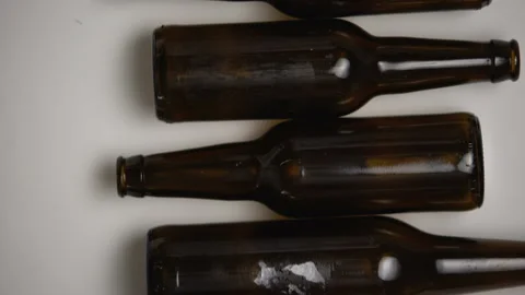 Glass bottles lying on waste sorting lin... | Stock Video | Pond5