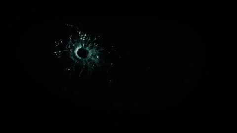 Glass breaking with bullet hole on black... | Stock Video | Pond5