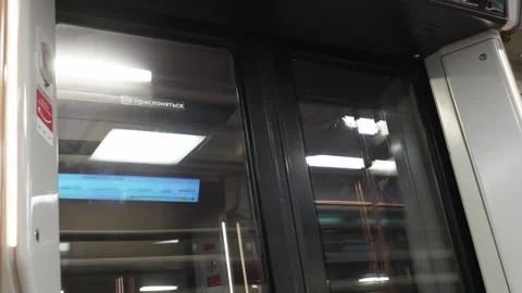 Glass doors in the subway train car. | Stock Video | Pond5
