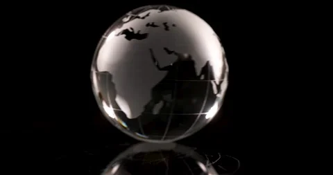 Glass globe with world map spinning on b... | Stock Video | Pond5