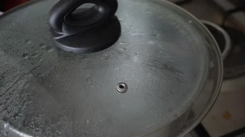 glass lid of the pot with condensation w... | Stock Video | Pond5