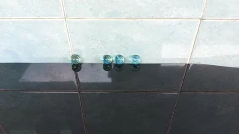 Marble Rolling Stock Footage ~ Royalty Free Stock Videos | Pond5