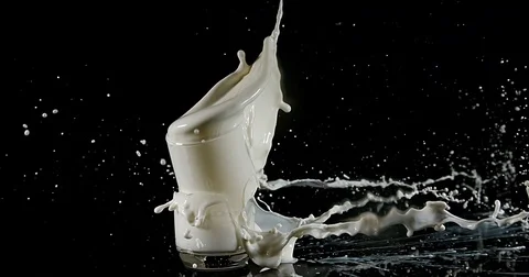 Glass of Milk Exploding against White Ba... | Stock Video | Pond5