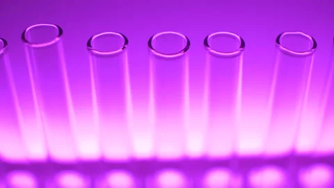 Glass test tubes in laboratory with purp... | Stock Video | Pond5