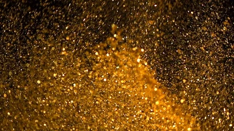 Glitter exploding golden sparkle. Explos... | Stock Video | Pond5