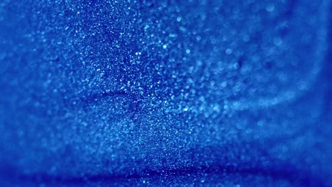 Glitter splash sparkling liquid blue glo... | Stock Video | Pond5