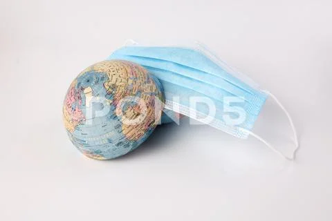 Globe planet world map earth wearing face mask on white background ...