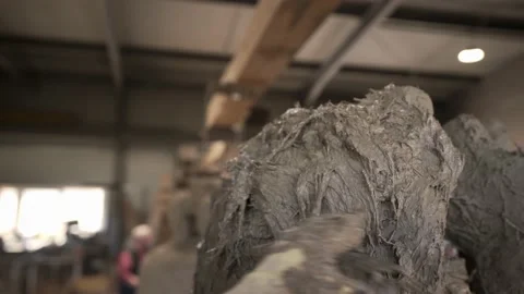 Gloved Hand Smearing Clay Mixture onto B... | Stock Video | Pond5