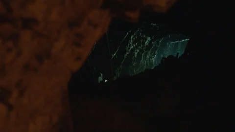 A glow on the far side of an underground... | Stock Video | Pond5
